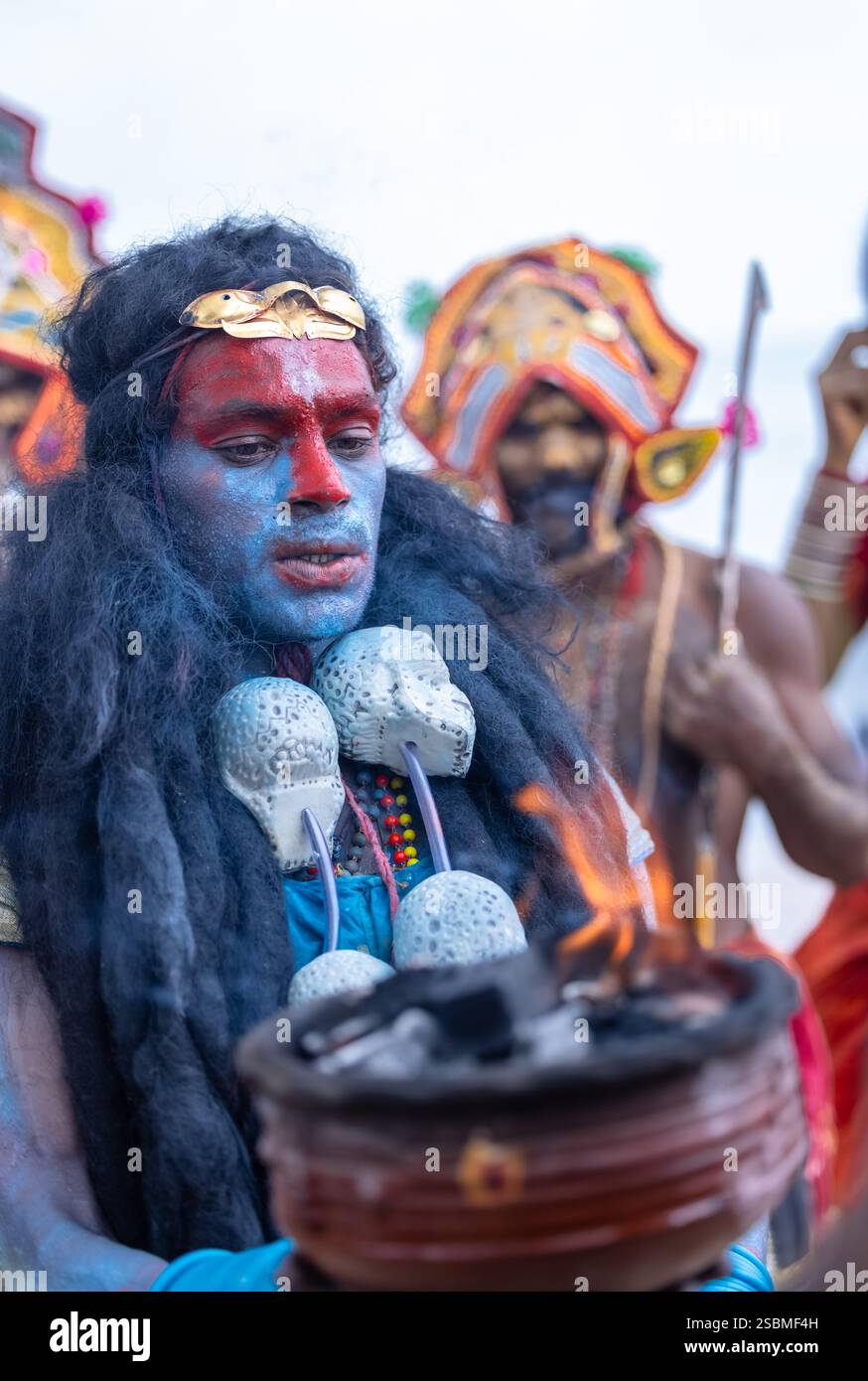 Kulasai, Portrait of indian hindu devotee with painted face and dressed ...