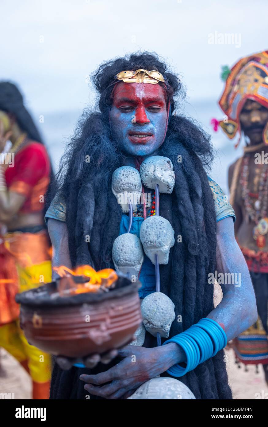 Kulasai, Portrait of indian hindu devotee with painted face and dressed ...