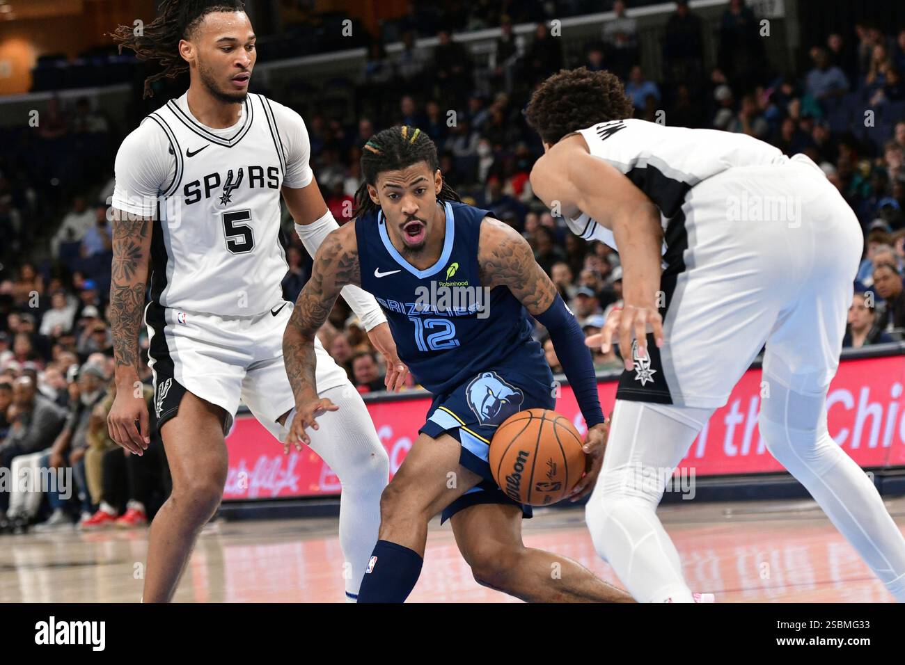 Memphis Grizzlies guard Ja Morant (12) handles the ball between San ...