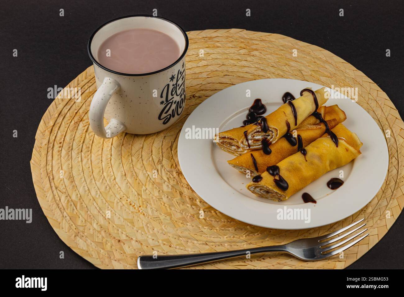 Delicious crepes filled with sweet ingredients are elegantly plated ...
