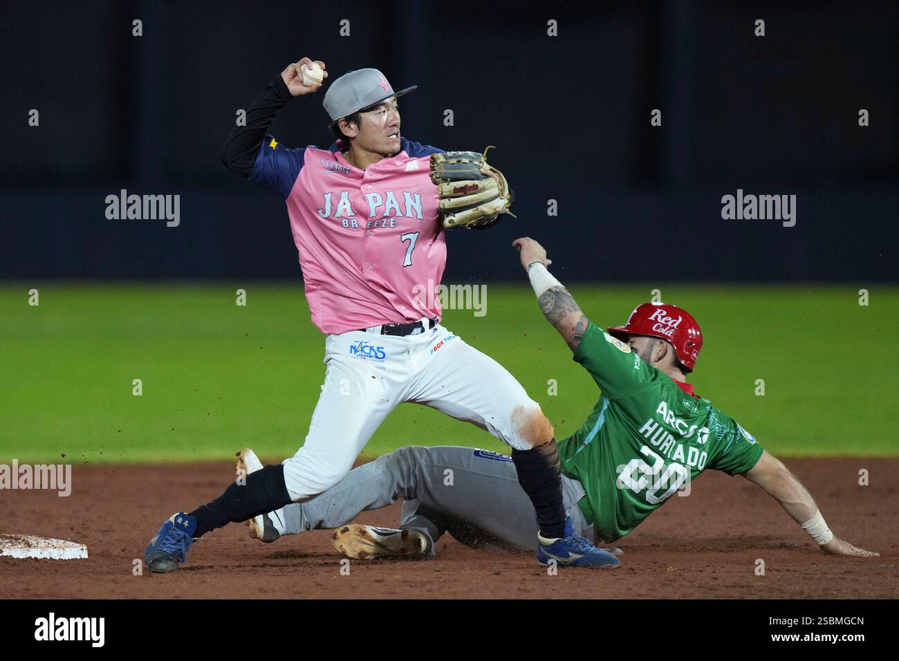 Japan's Yuta Hamada (7) throws the ball to first base after tagging Mexico's Alfredo Hurtado (20 ...
