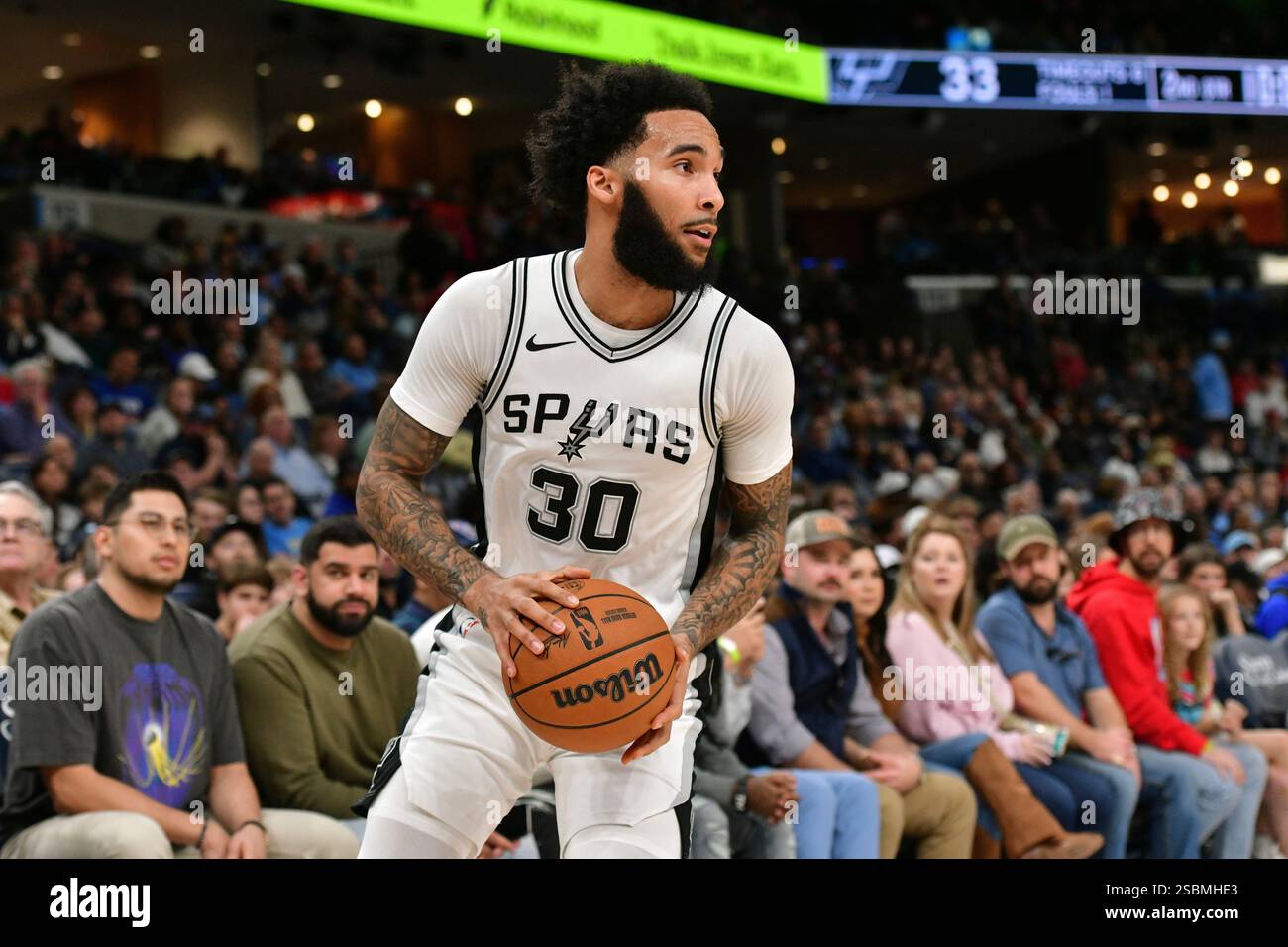 San Antonio Spurs forward Julian Champagnie (30) handles the ball in ...