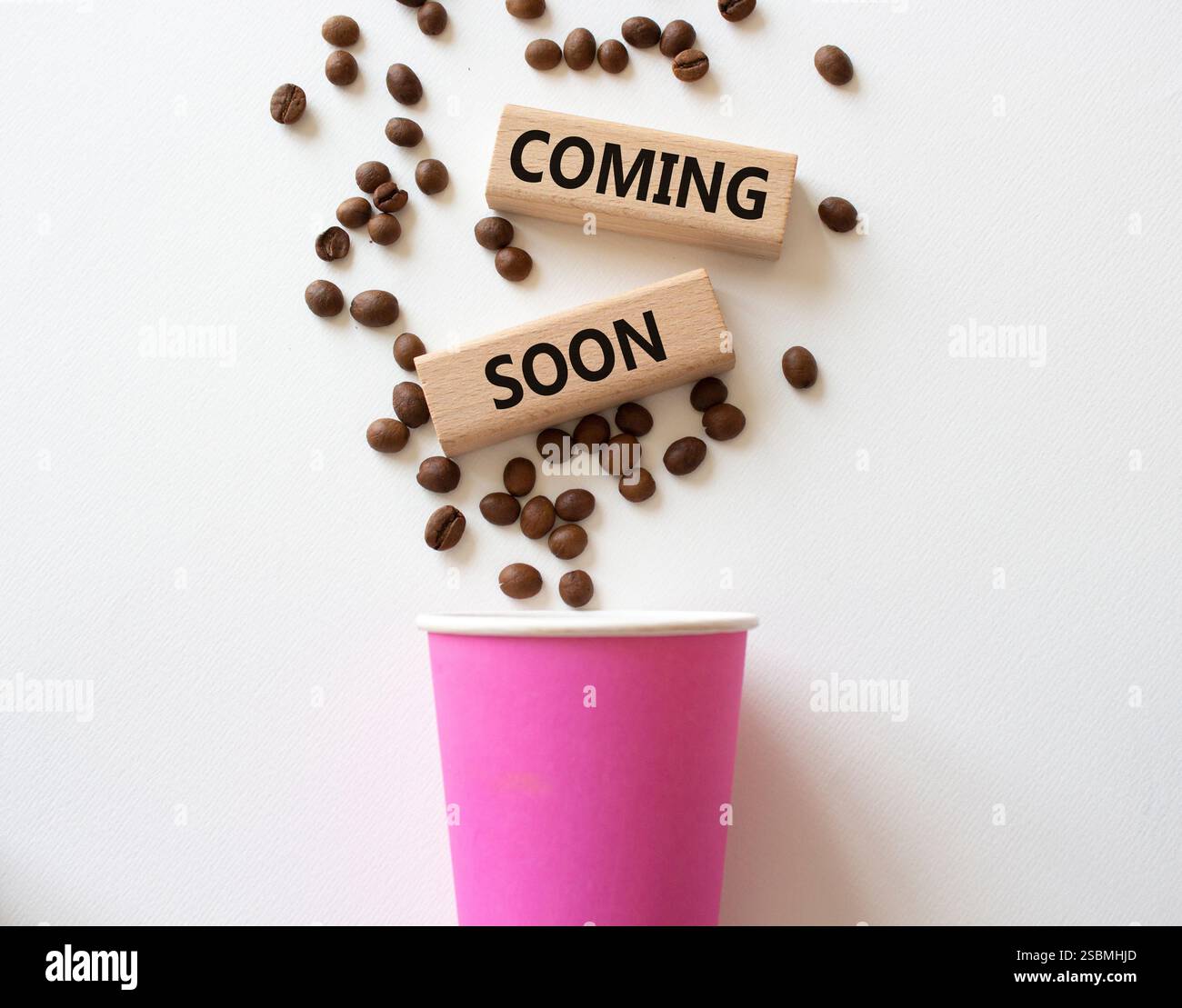 Coming Soon symbol. Concept word Coming Soon on wooden blocks ...