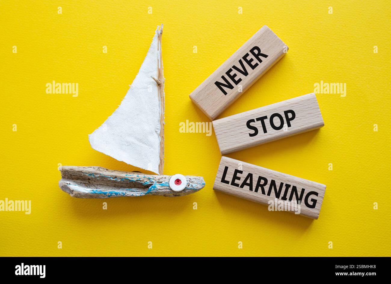 Never stop Learning symbol. Concept words Never stop Learning on wooden ...