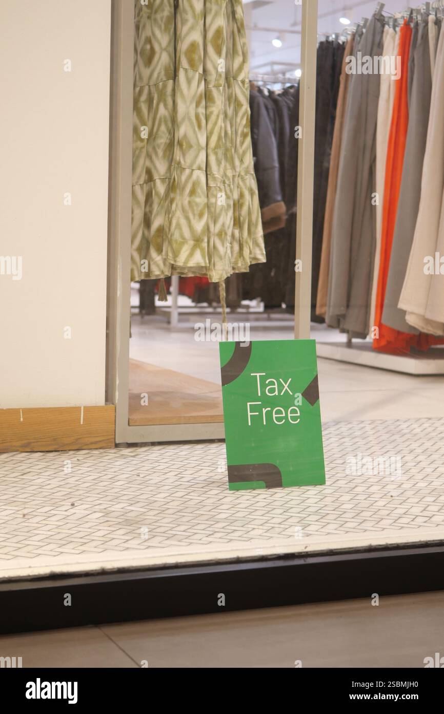 Tax-free sign at the entrance of a clothing store Stock Photo - Alamy