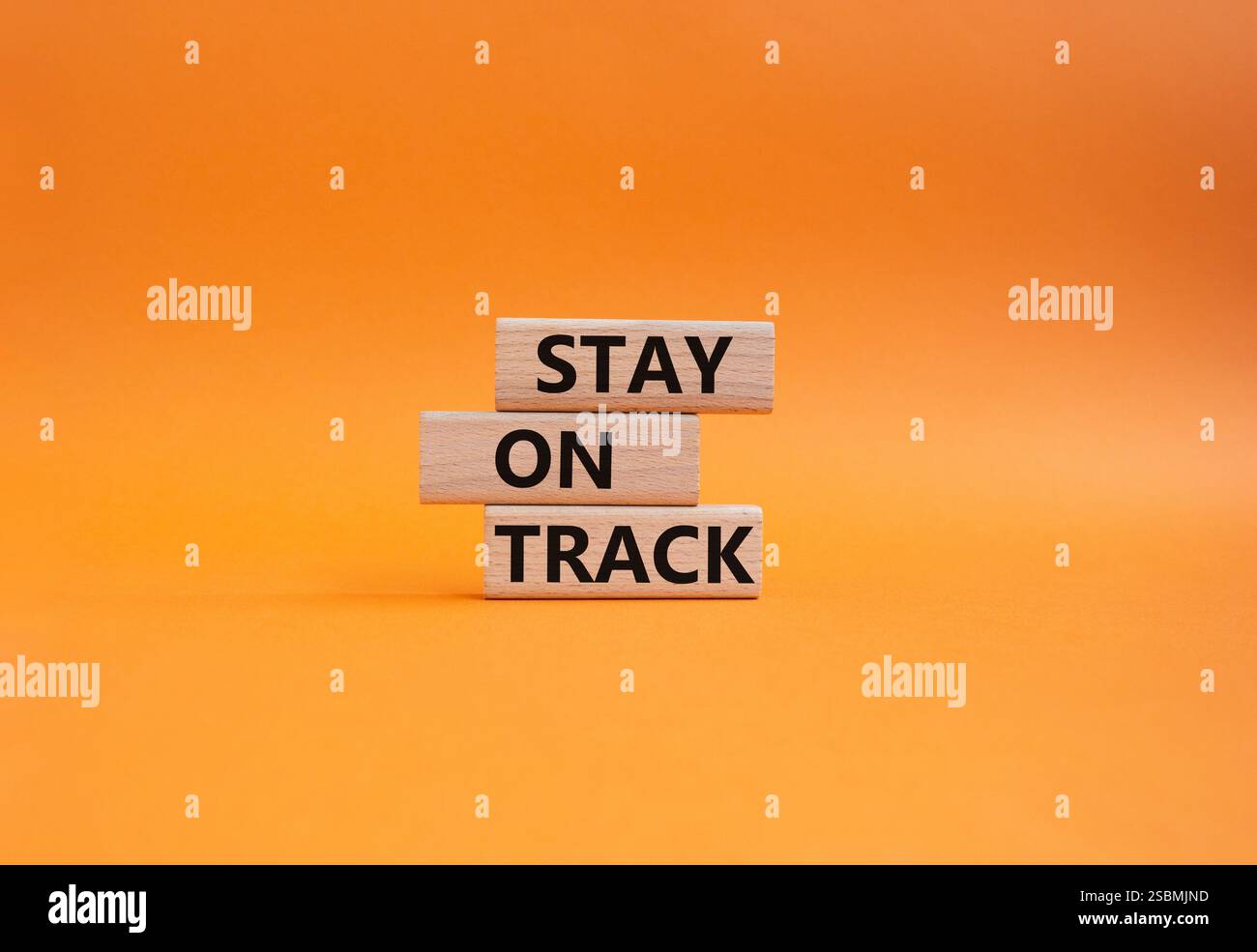 Stay on track symbol. Wooden blocks with words 'Stay on track ...