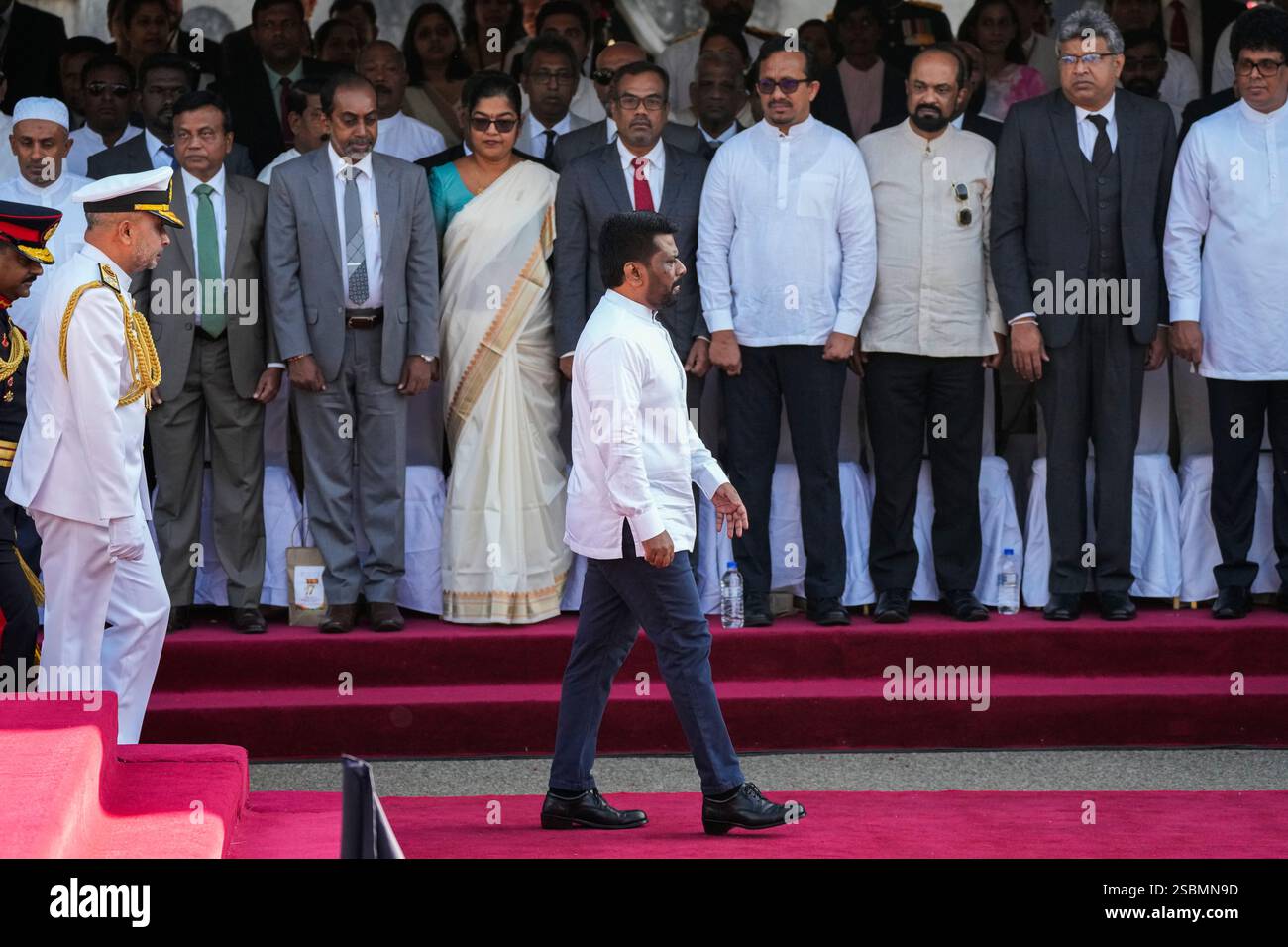 Sri Lankan President Anura Kumara Dissanayake walks past his cabinet members during the country ...