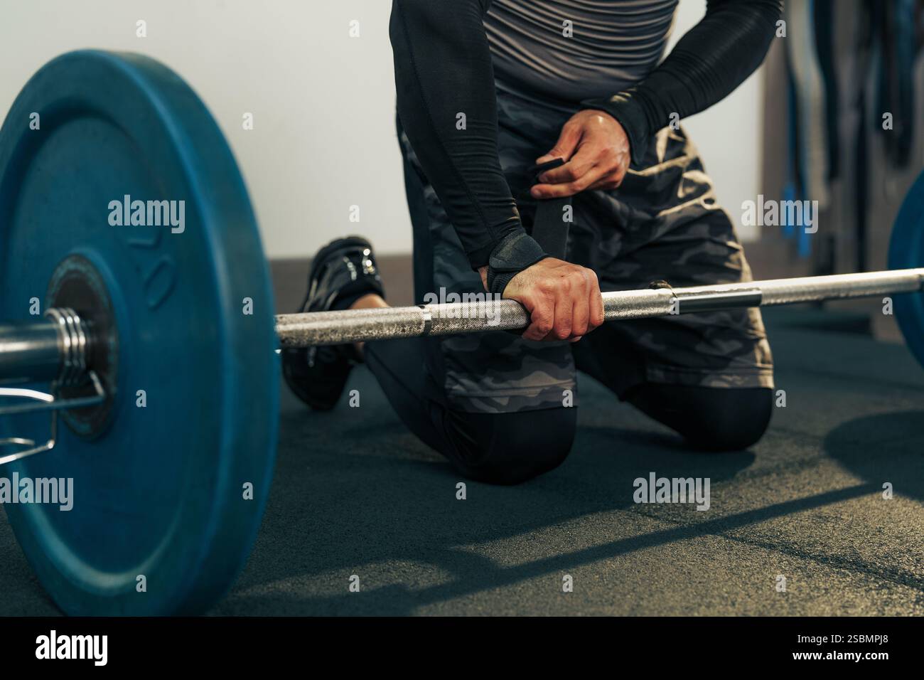 Strength training session with weights on the gym floor during a ...