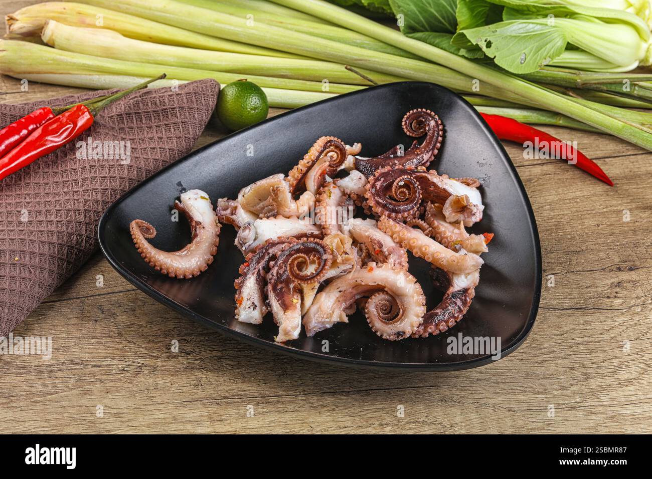 Grilled octopus red tentacle sliced appetizer Stock Photo - Alamy