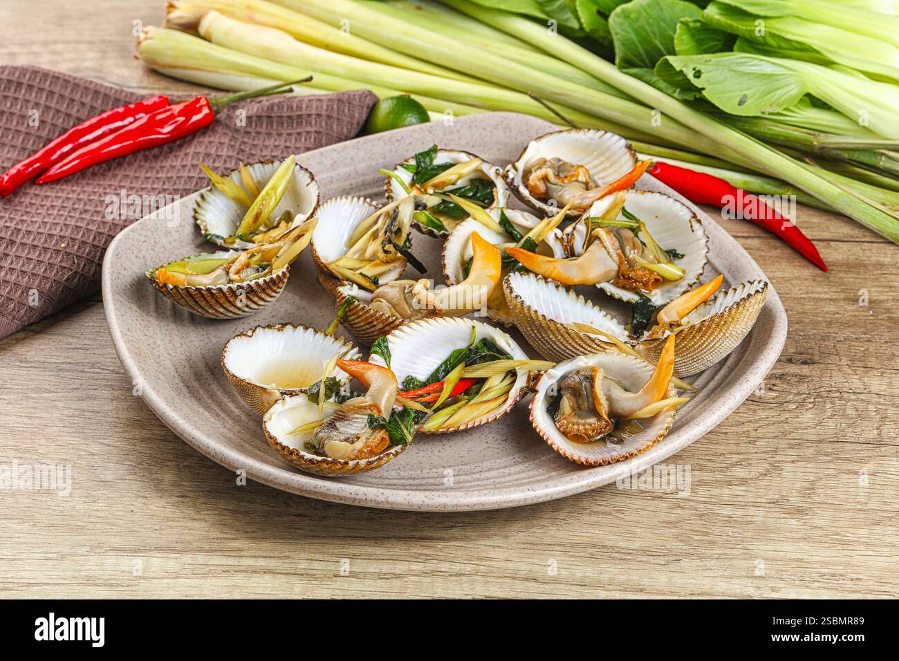 Delicous Asian mollusk shell steamed with spices Stock Photo - Alamy