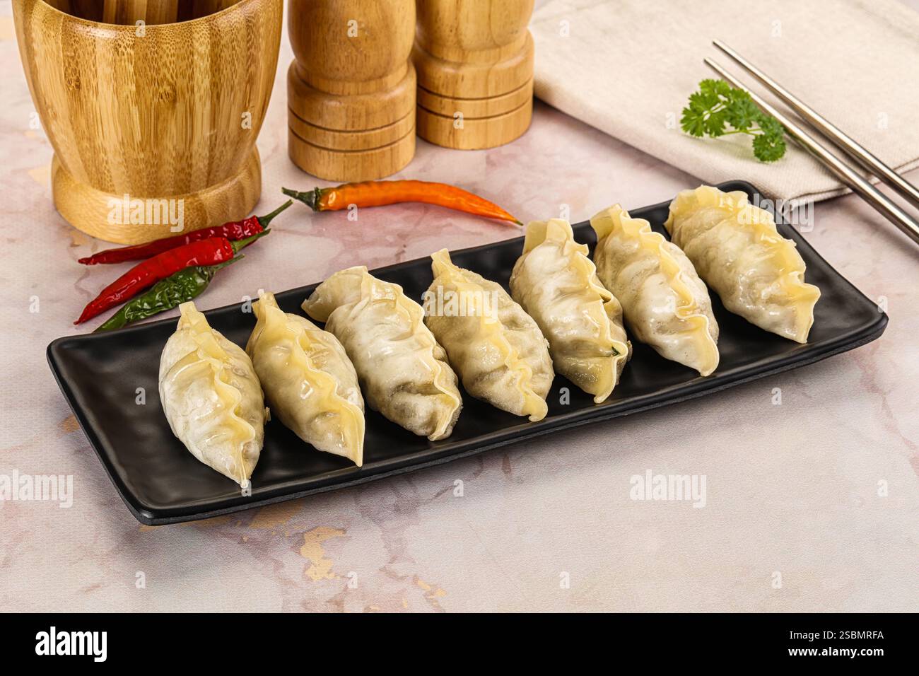 Japanese steamed Gyoza - traditional stuffed dumplings Stock Photo - Alamy