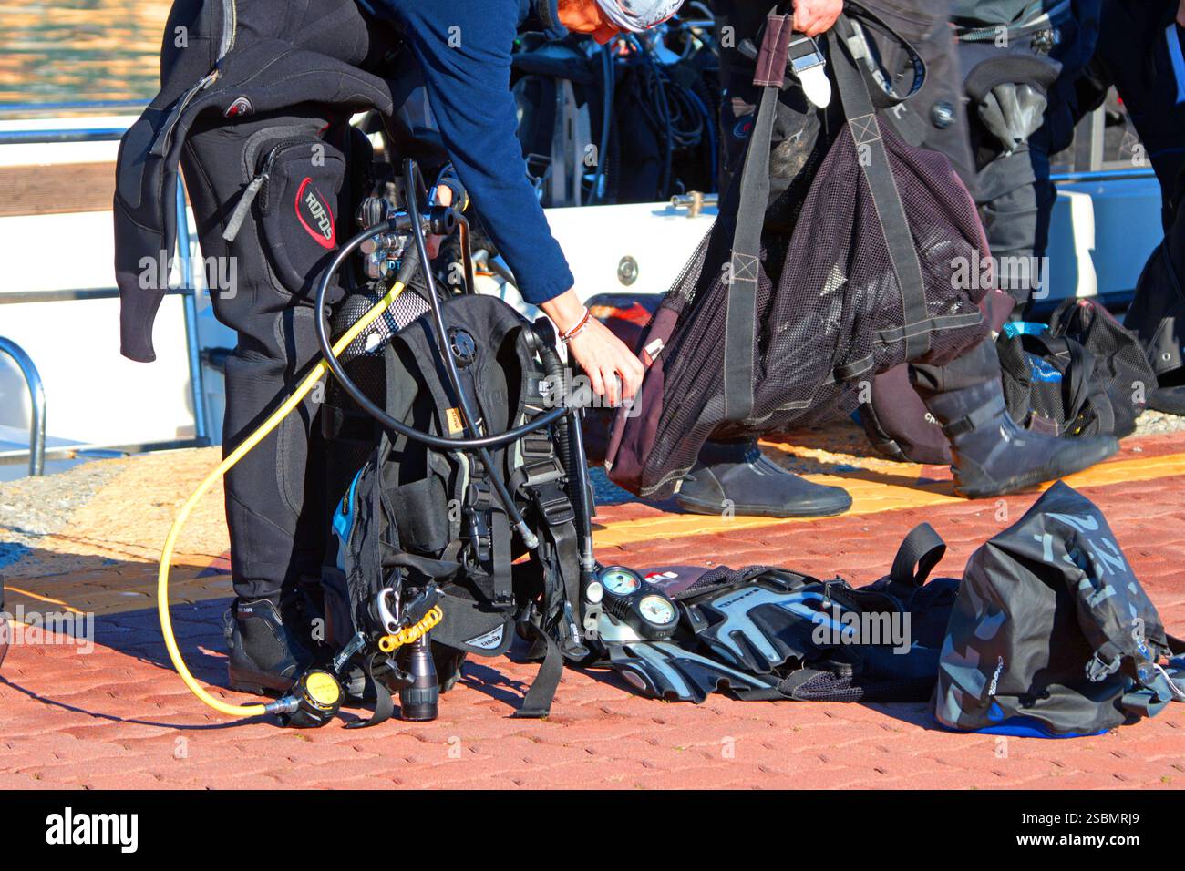 Anonymous diver prepares gear. Sports and equipment. Tourism and travel ...