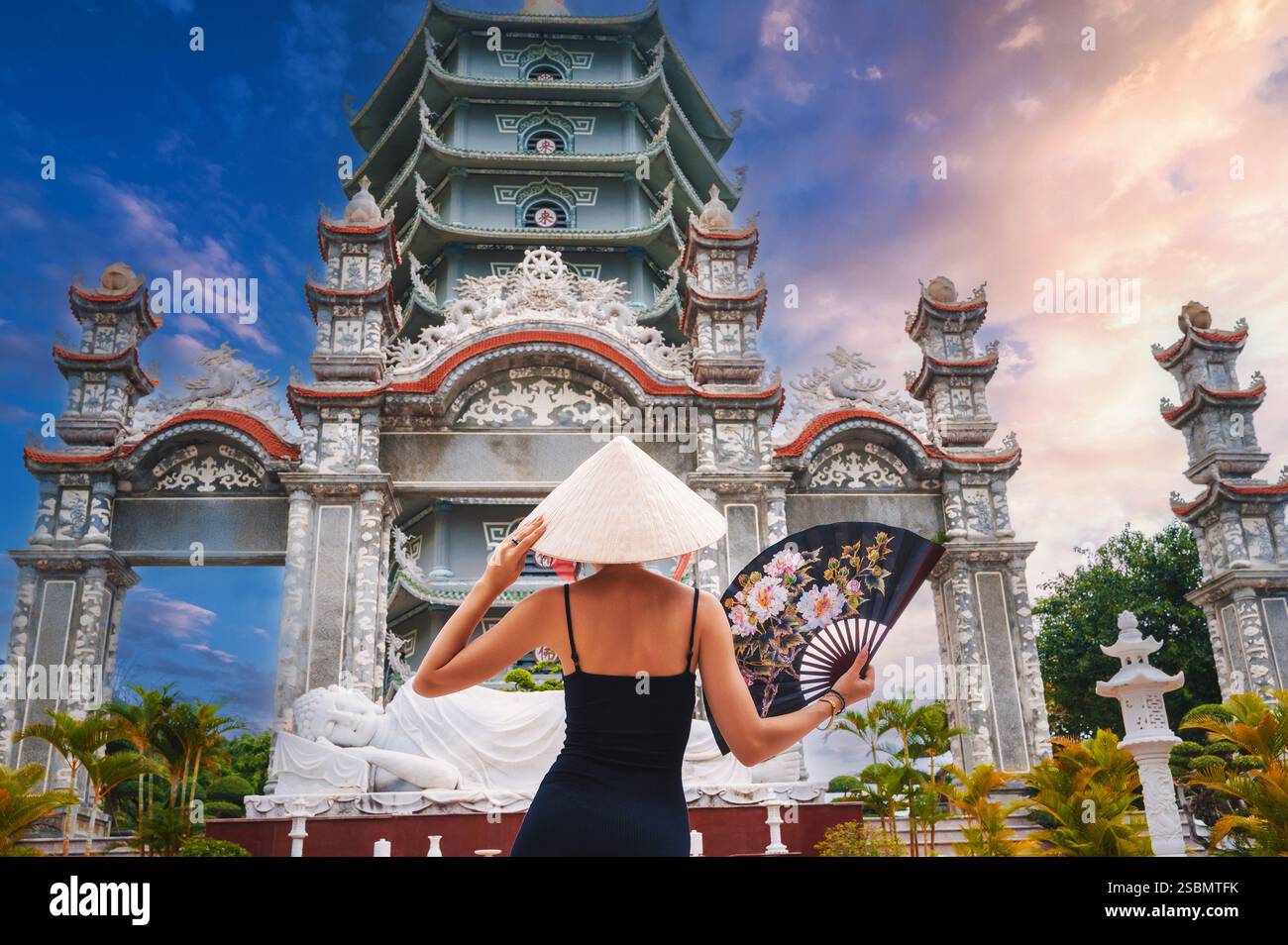 back of a female tourist in a Vietnamese Non La hat at the Da Nang ...