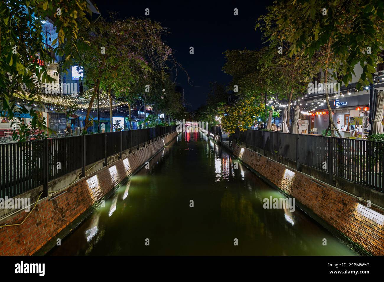 Restaurants and other small businesses by a small canal at the ...