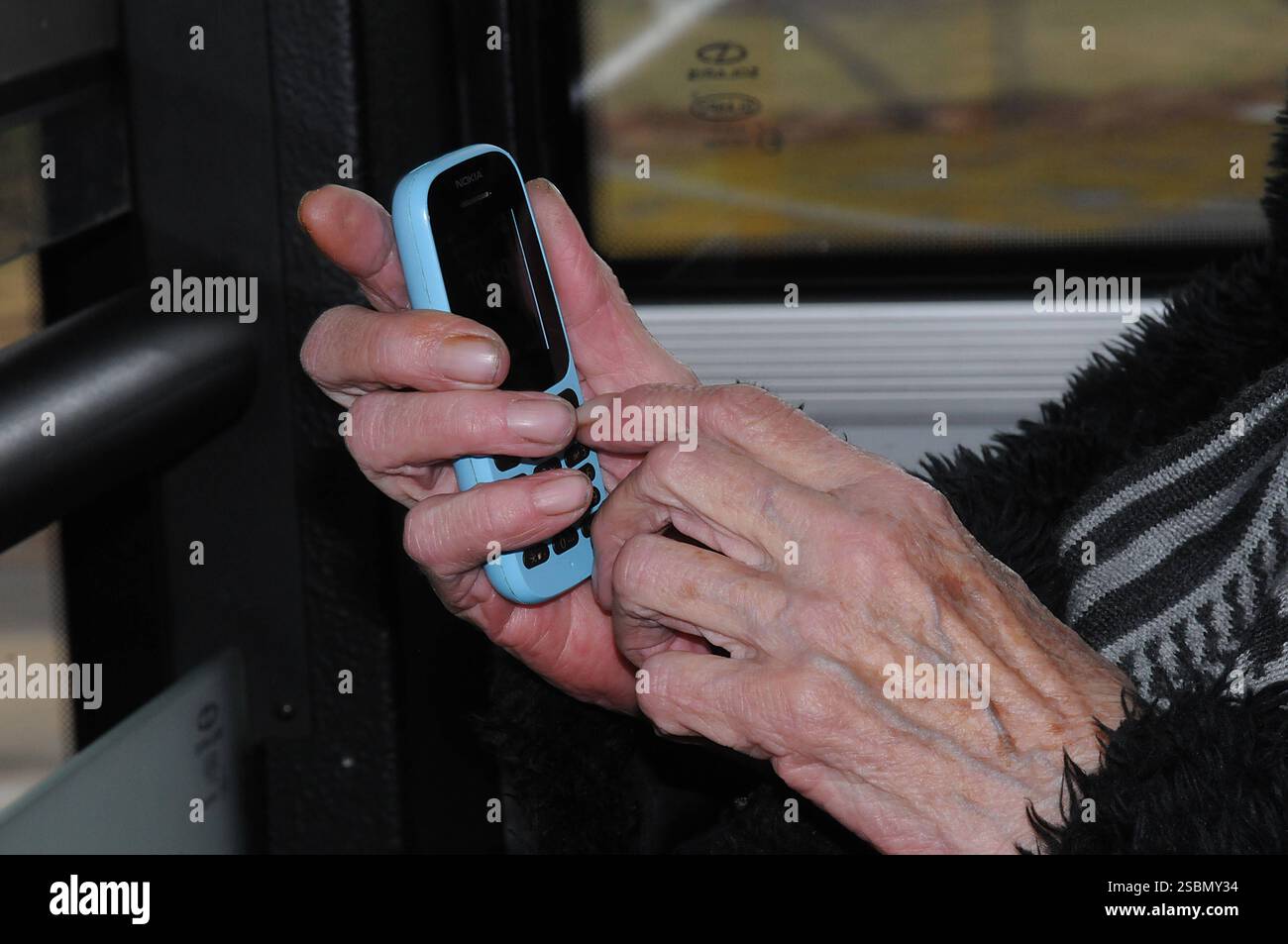 Copenhagen, Denmark. 15 March 2021, Senior citizen with old nokia model ...