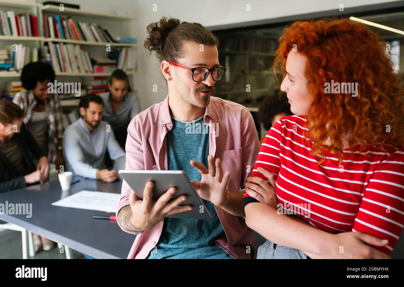 Group of business people and software developers working as a team in ...