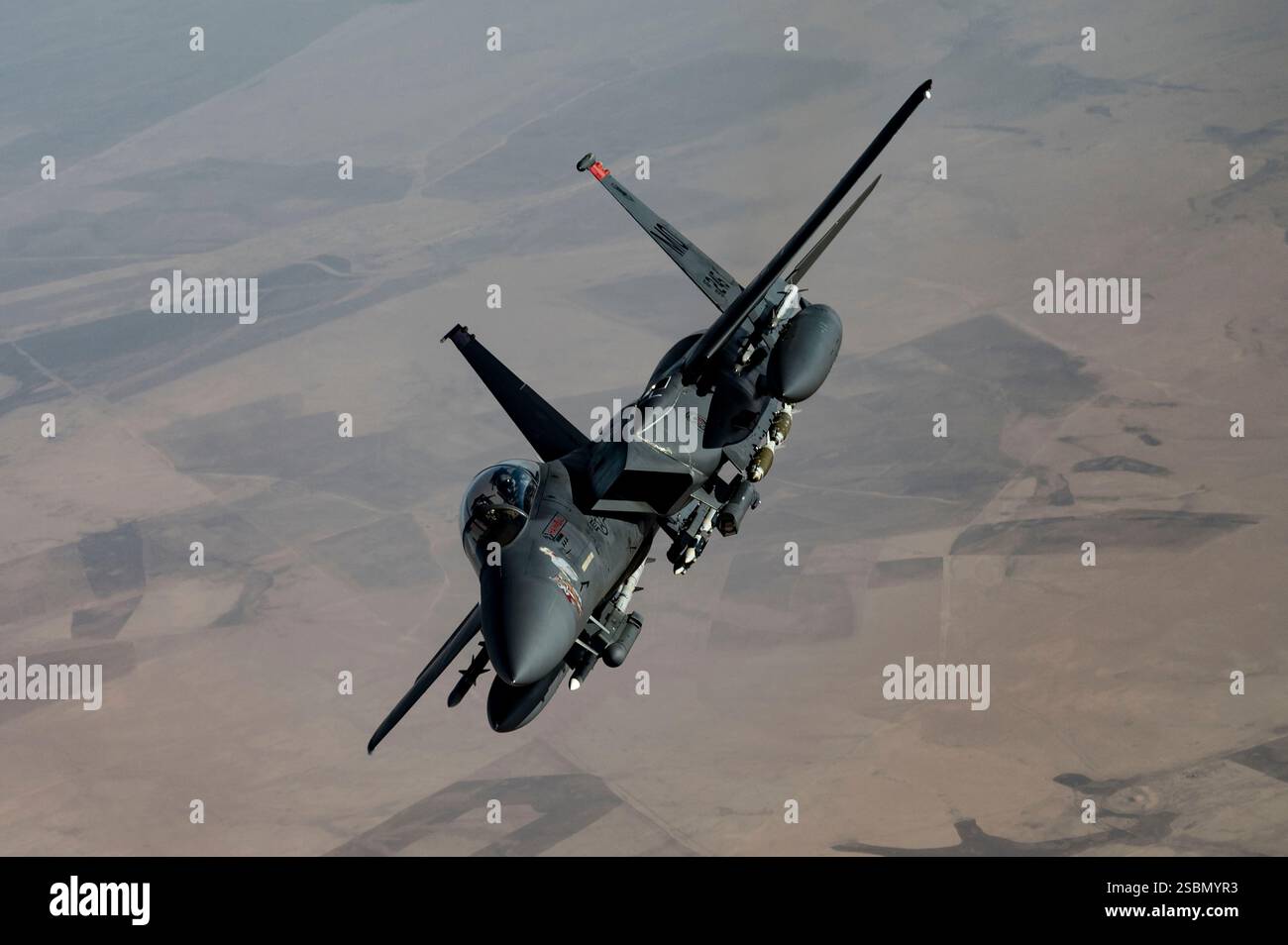 A U.S. Air Force F-15E Strike Eagle flies over the U.S. Central Command ...