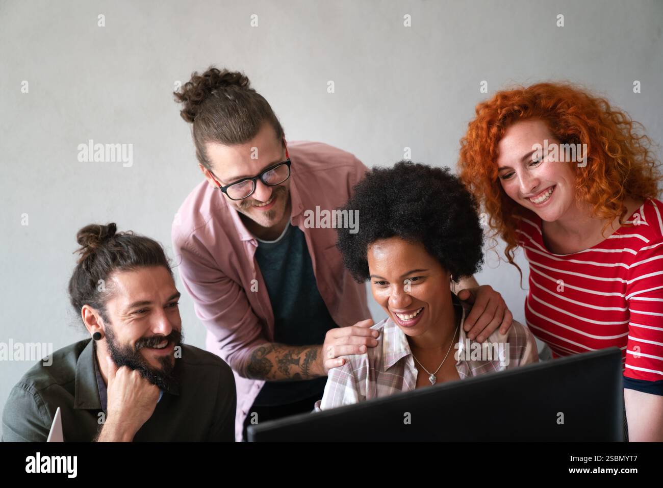 Mixed team of software engineers brainstorming ideas. Diverse app developers collaborating as ...