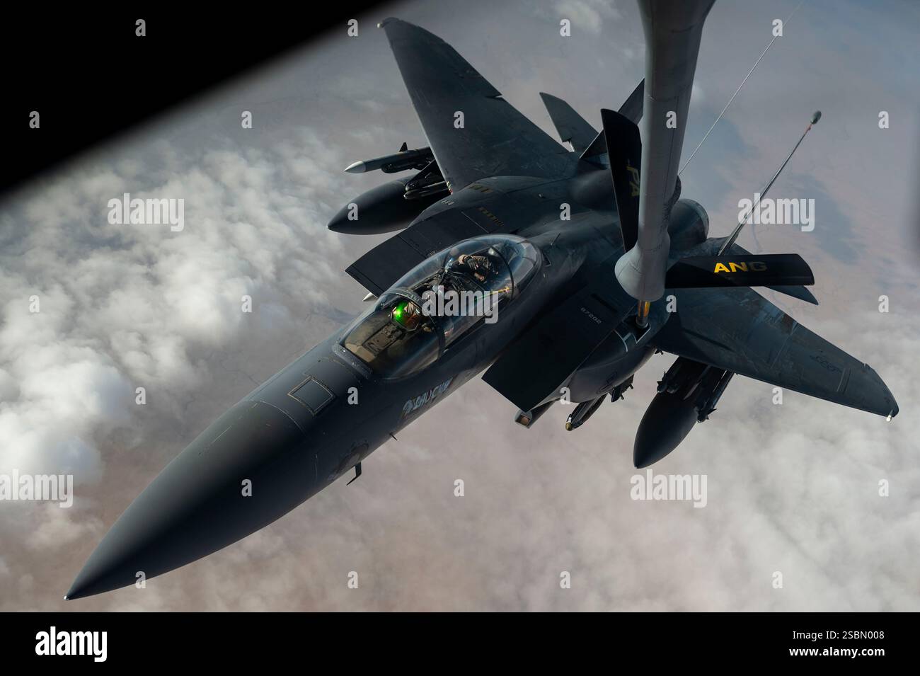 A U.S. Air Force F-15E Strike Eagle is refueled over the U.S. Central ...