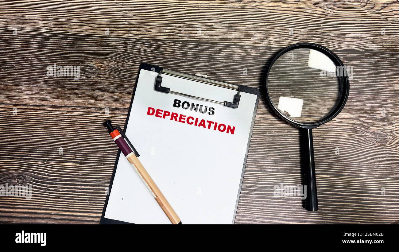 Concept of Bonus Depreciation write on paperwork isolated on Wooden ...