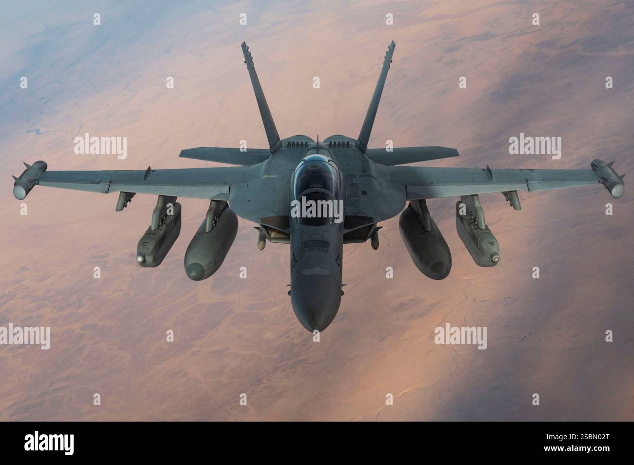 A U.S. Navy EA-18G Growler flies over the U.S. Central Command area of ...