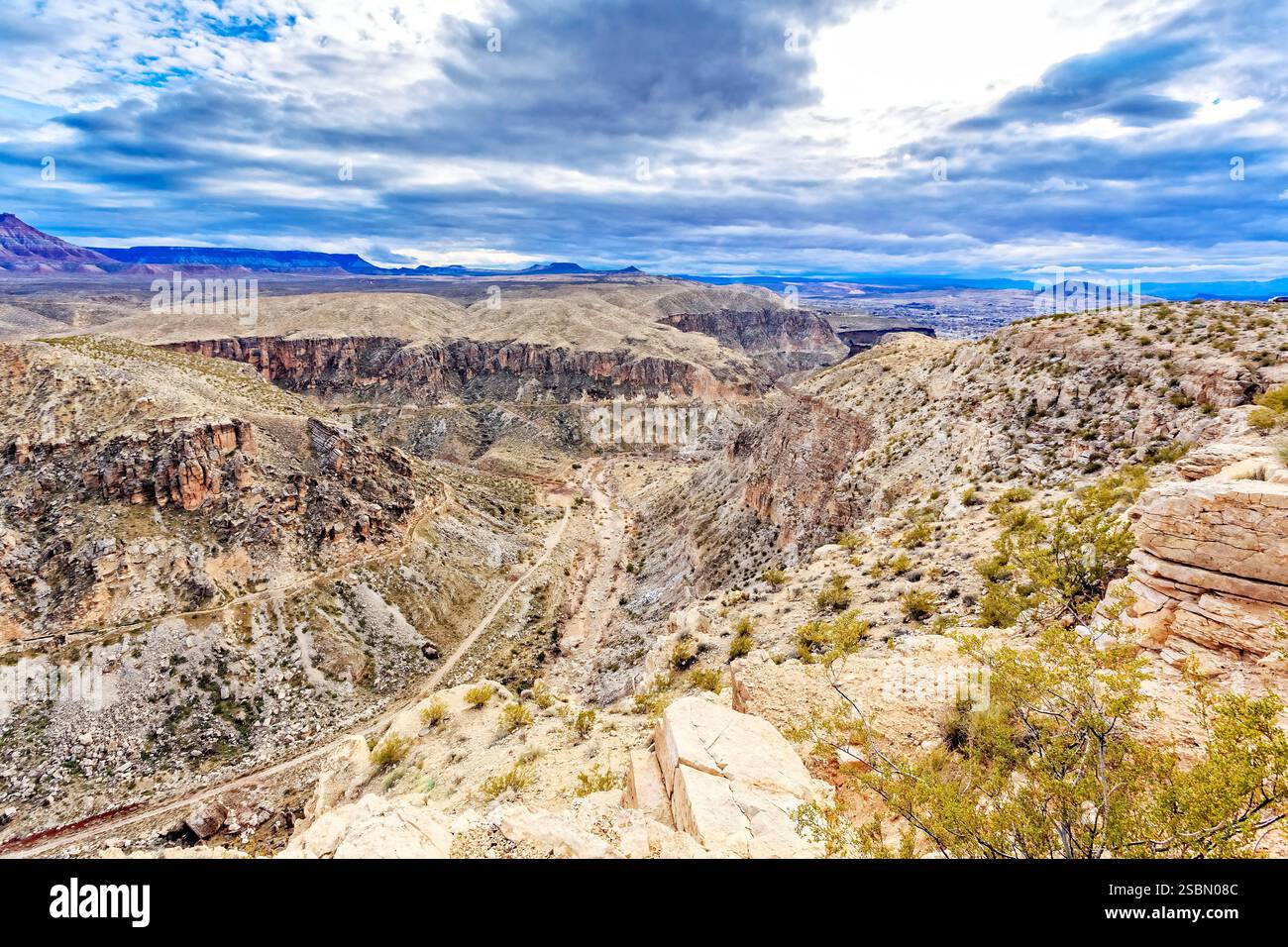 Mountain range with a valley in between. The valley is surrounded by ...