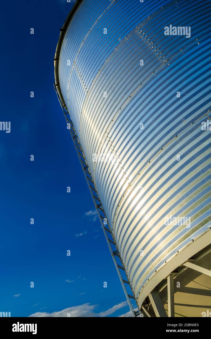 Large silver metal structure with a blue sky in the background. The ...