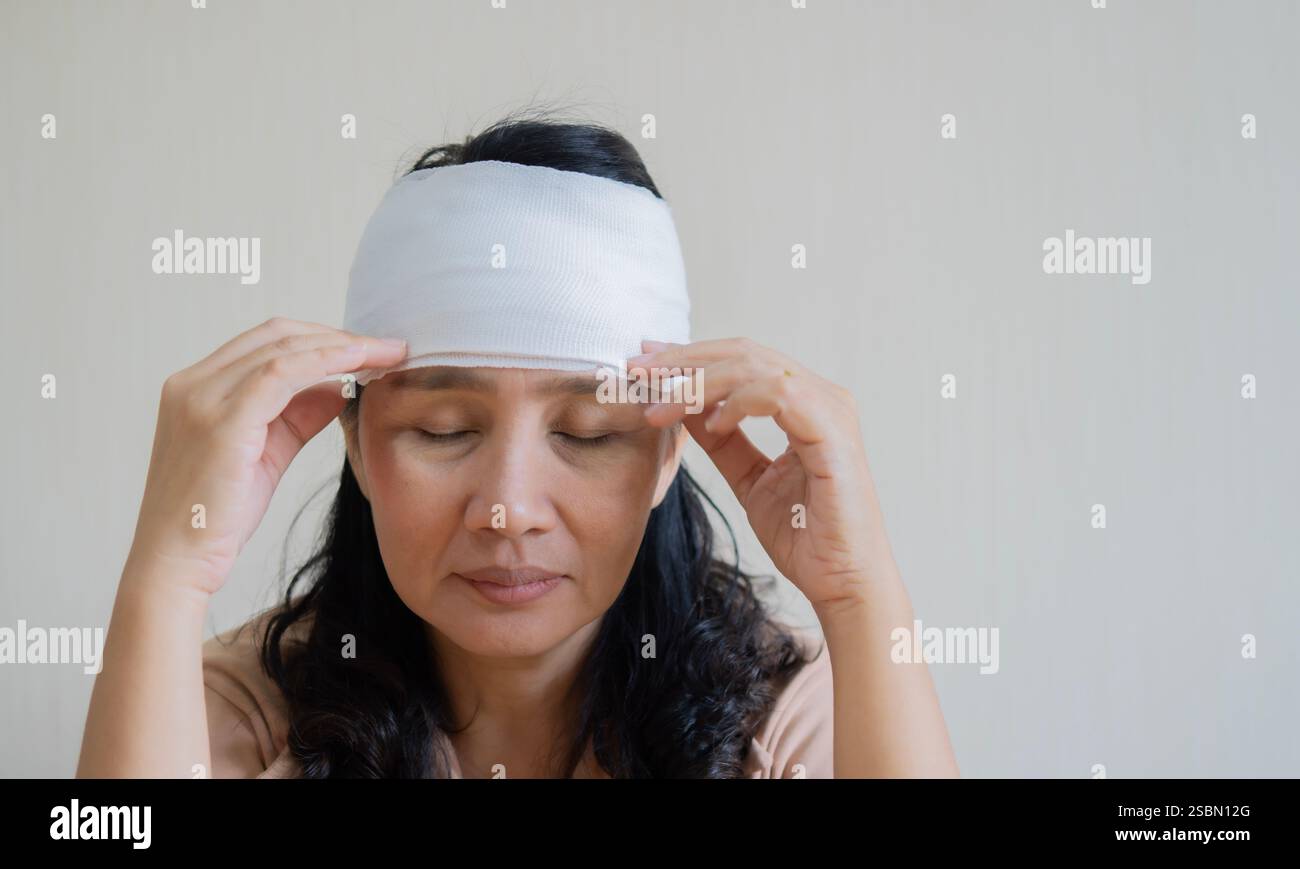 Injured woman after surgery with bandage. Image related with treatment ...