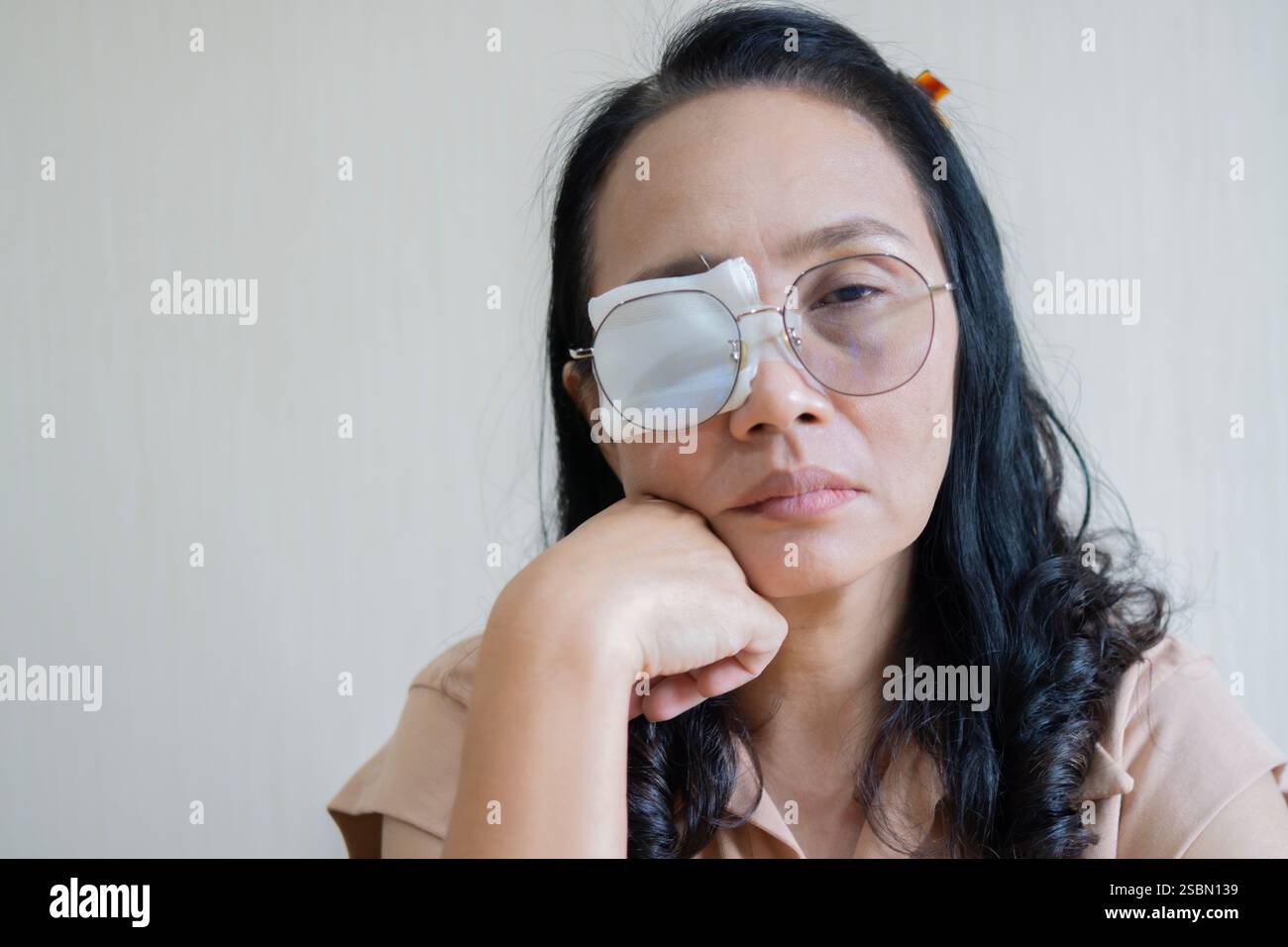 Medicine plaster patch on Asian woman injury wound eye with copy space ...