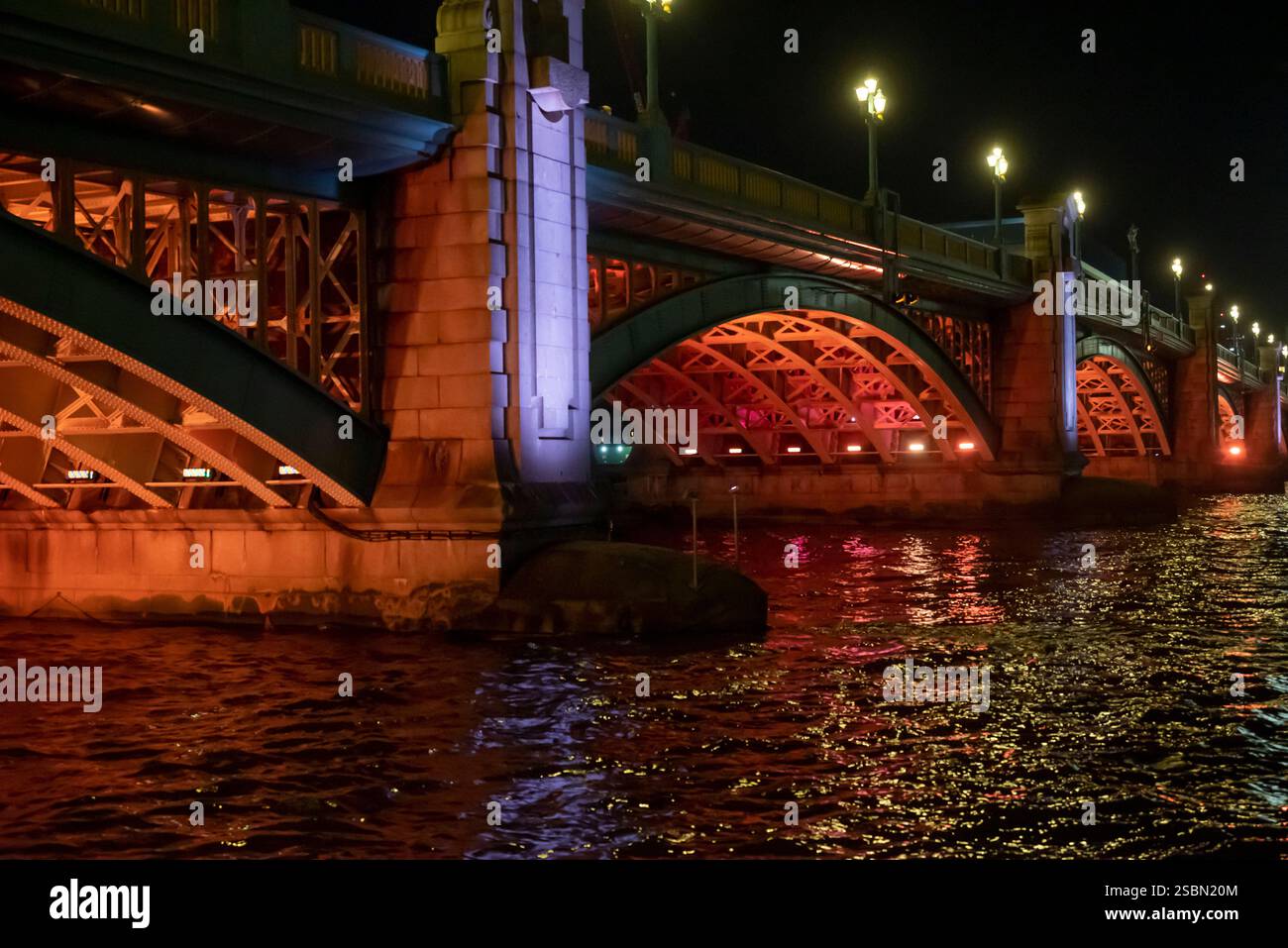 Blackfriars Bridge lit with red light at night, London, England, UK ...