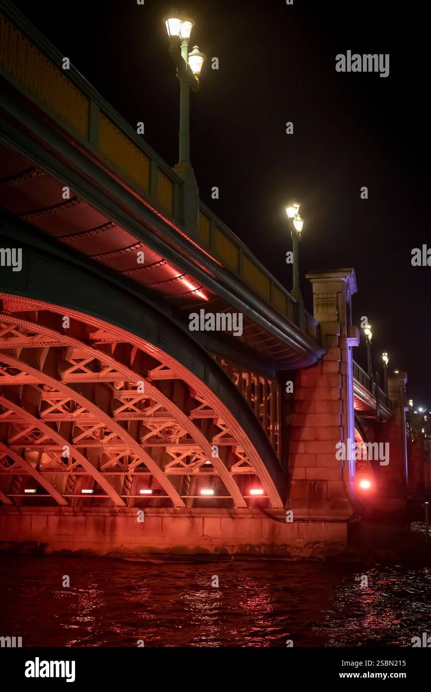 Blackfriars Bridge lit with red light at night, London, England, UK ...