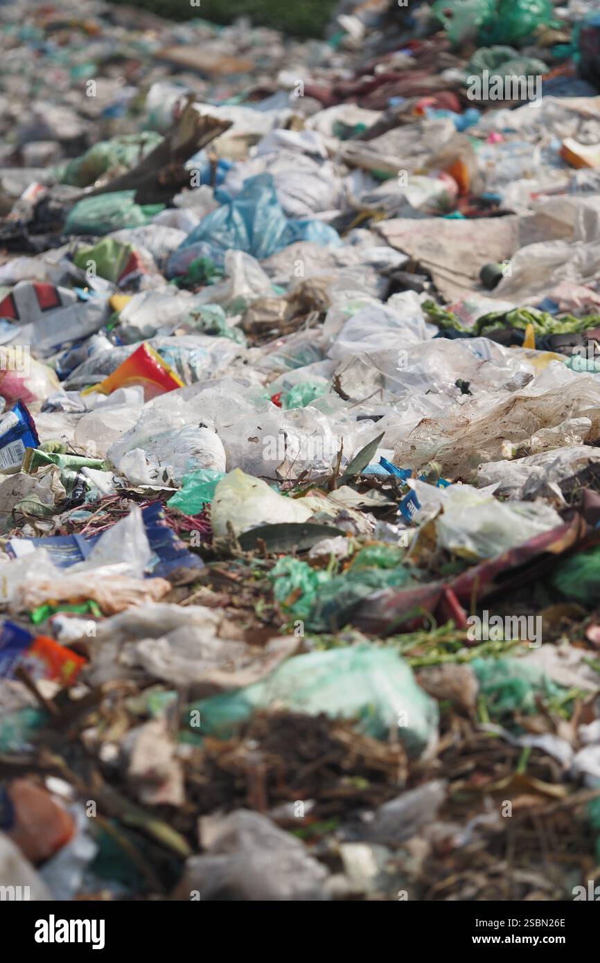Plastic waste littering a natural landscape in daylight Stock Photo - Alamy