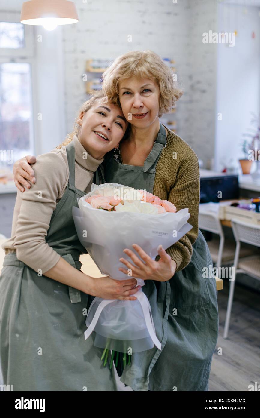 Generational connection, young woman surprises her elderly mother with ...