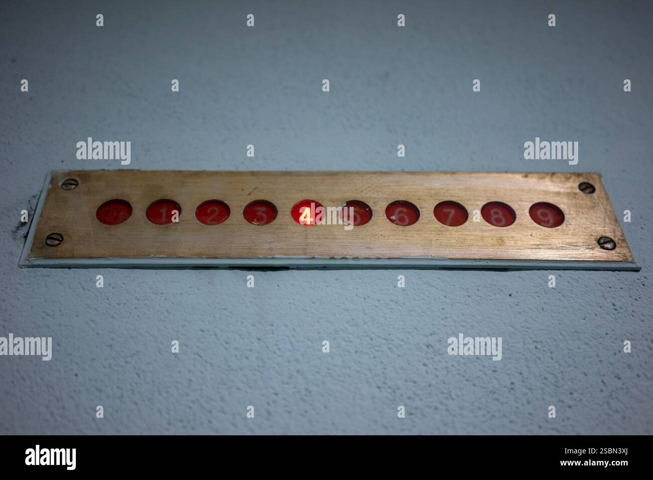 Bottom view of the floor number board above the elevator entrance. The ...