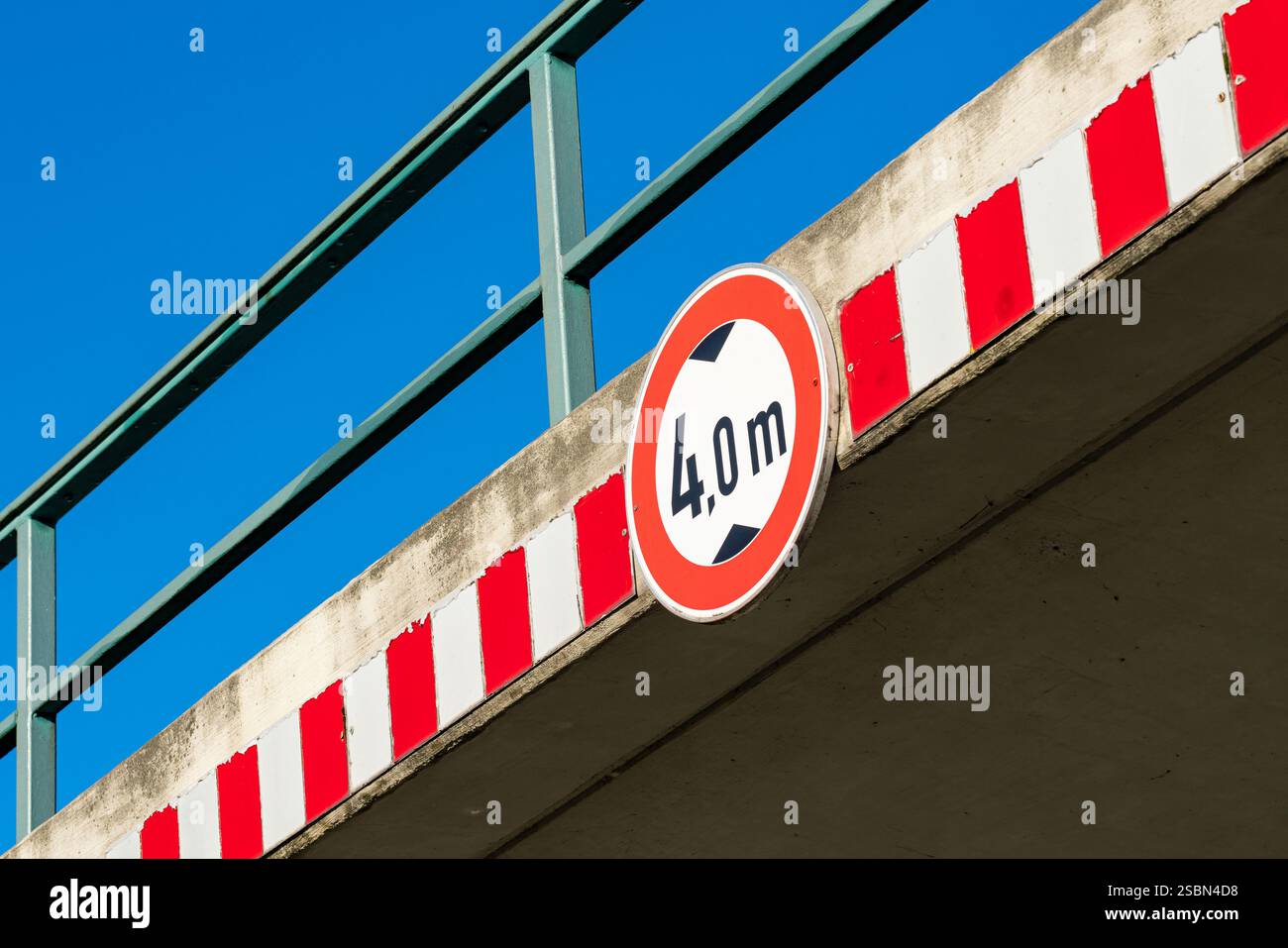 A height restriction sign clearly displays a limit of 4 meters on a ...