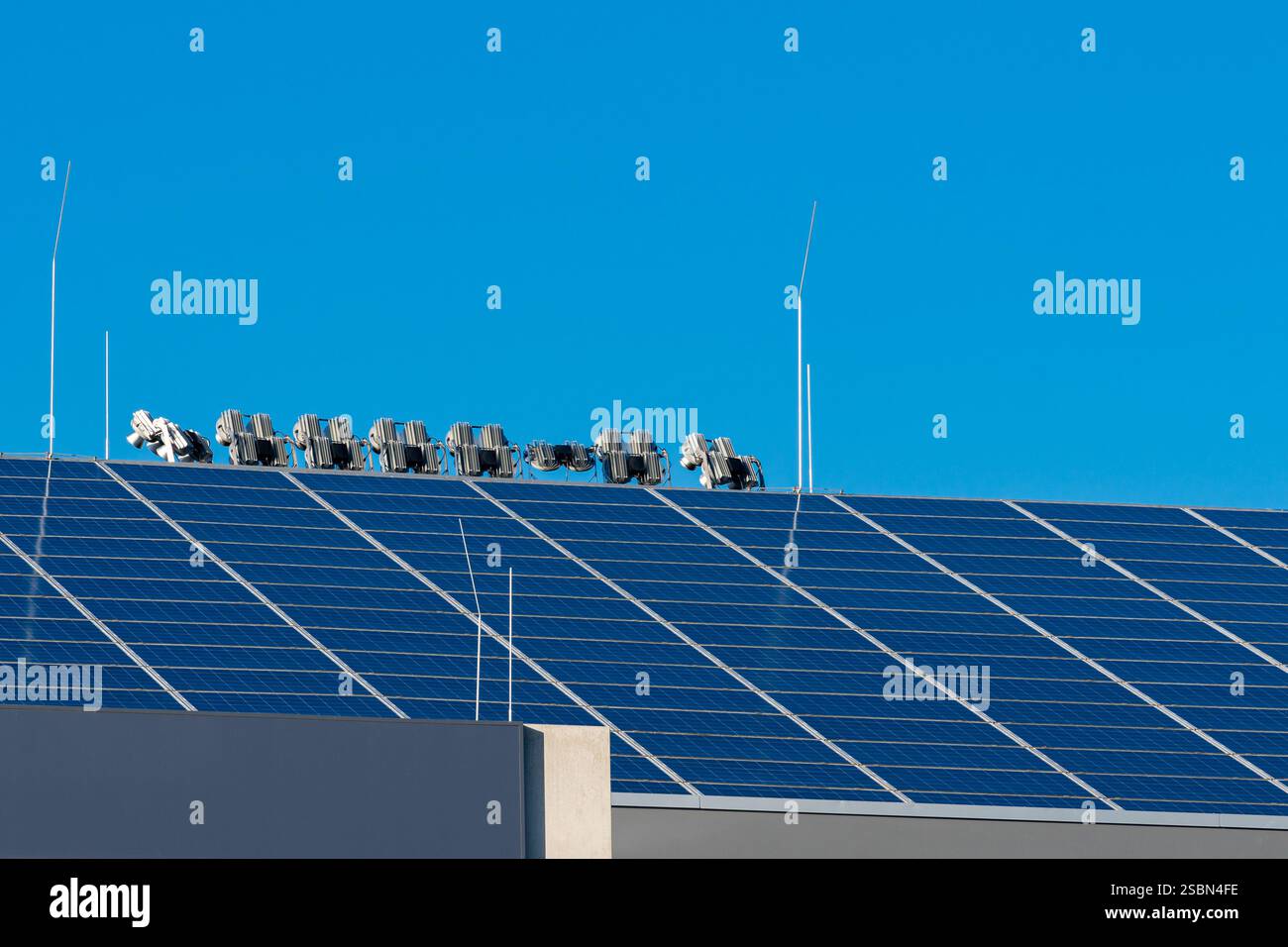 Bright solar panels are installed on a rooftop, effectively converting ...