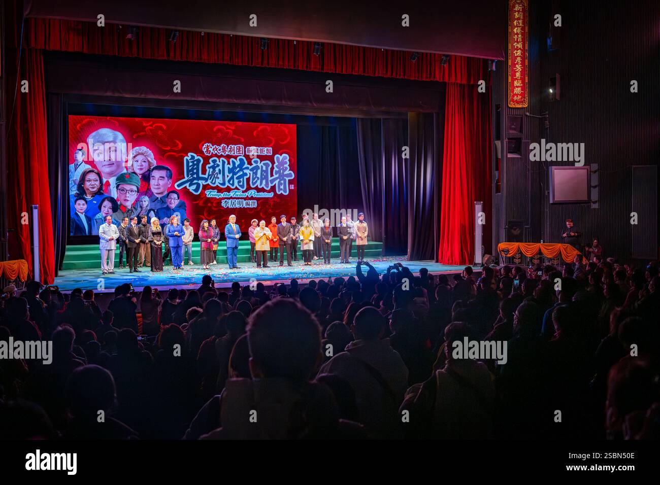 Opera playwright Li Kui-Ming and other actors stand on stage at the end ...