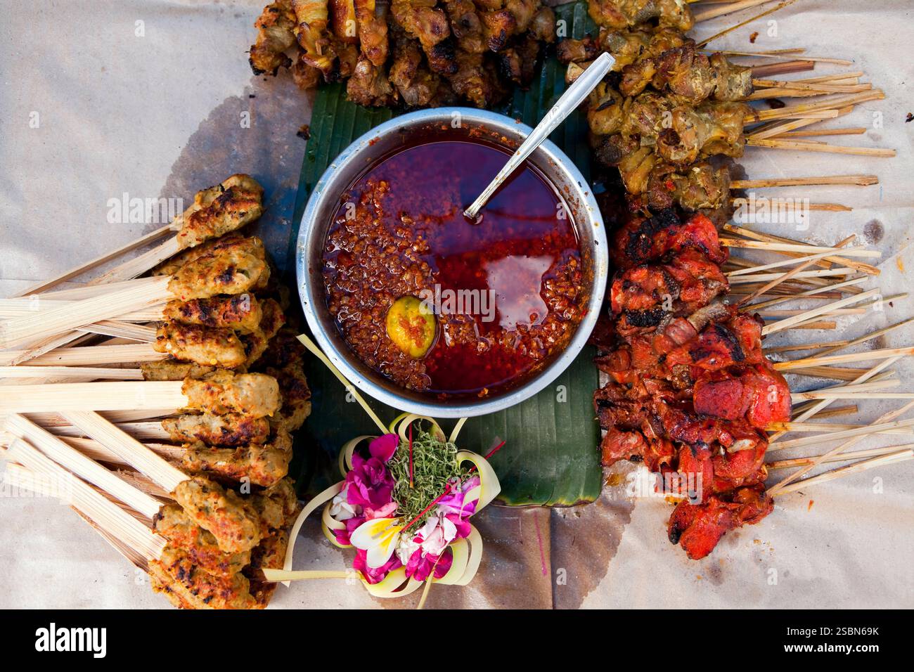 An assortment of grilled chicken satay. Satay or sate is a Javanese ...