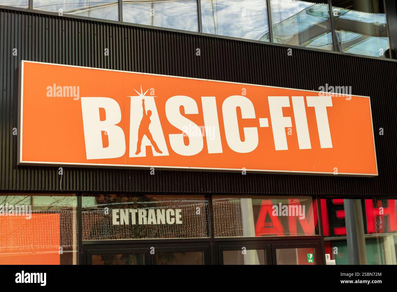 Basic Fit logo at the gym. Basic-Fit is the largest fitness chain in Europe Stock Photo - Alamy