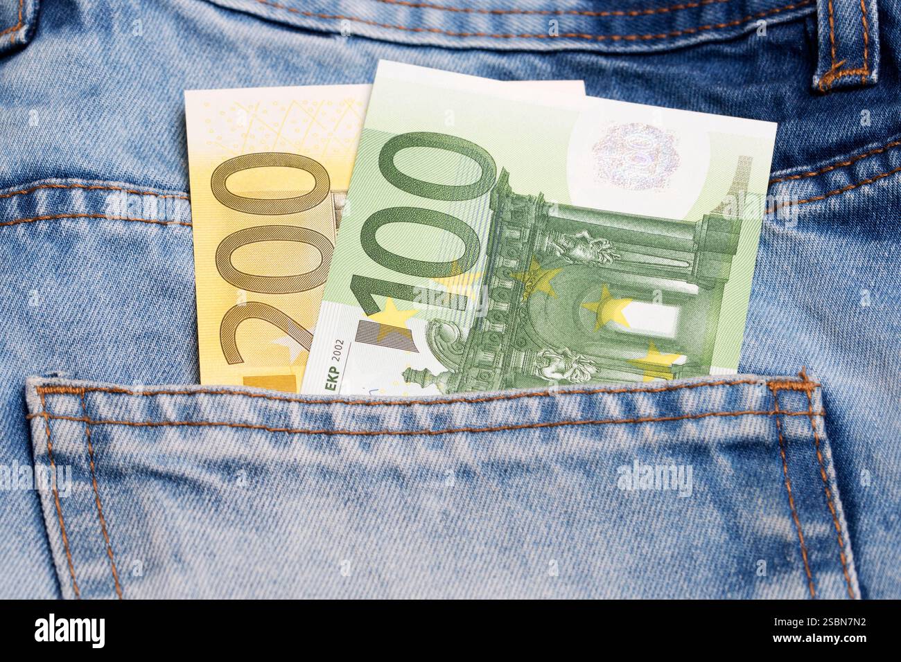 European money - Euro in the pocket of blue jeans Stock Photo - Alamy