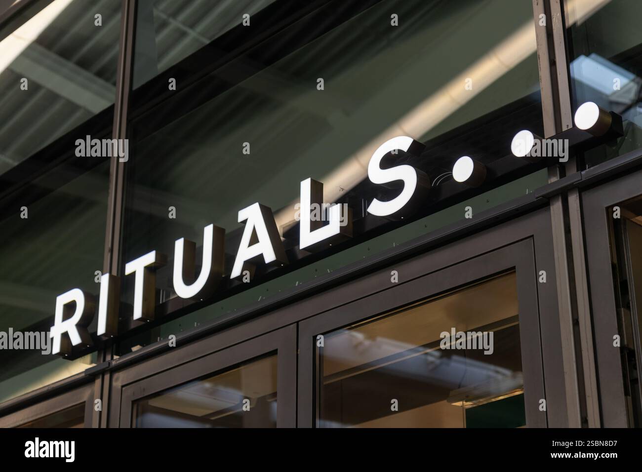 Rituals shop front logo with flowers in the background. a Dutch company ...