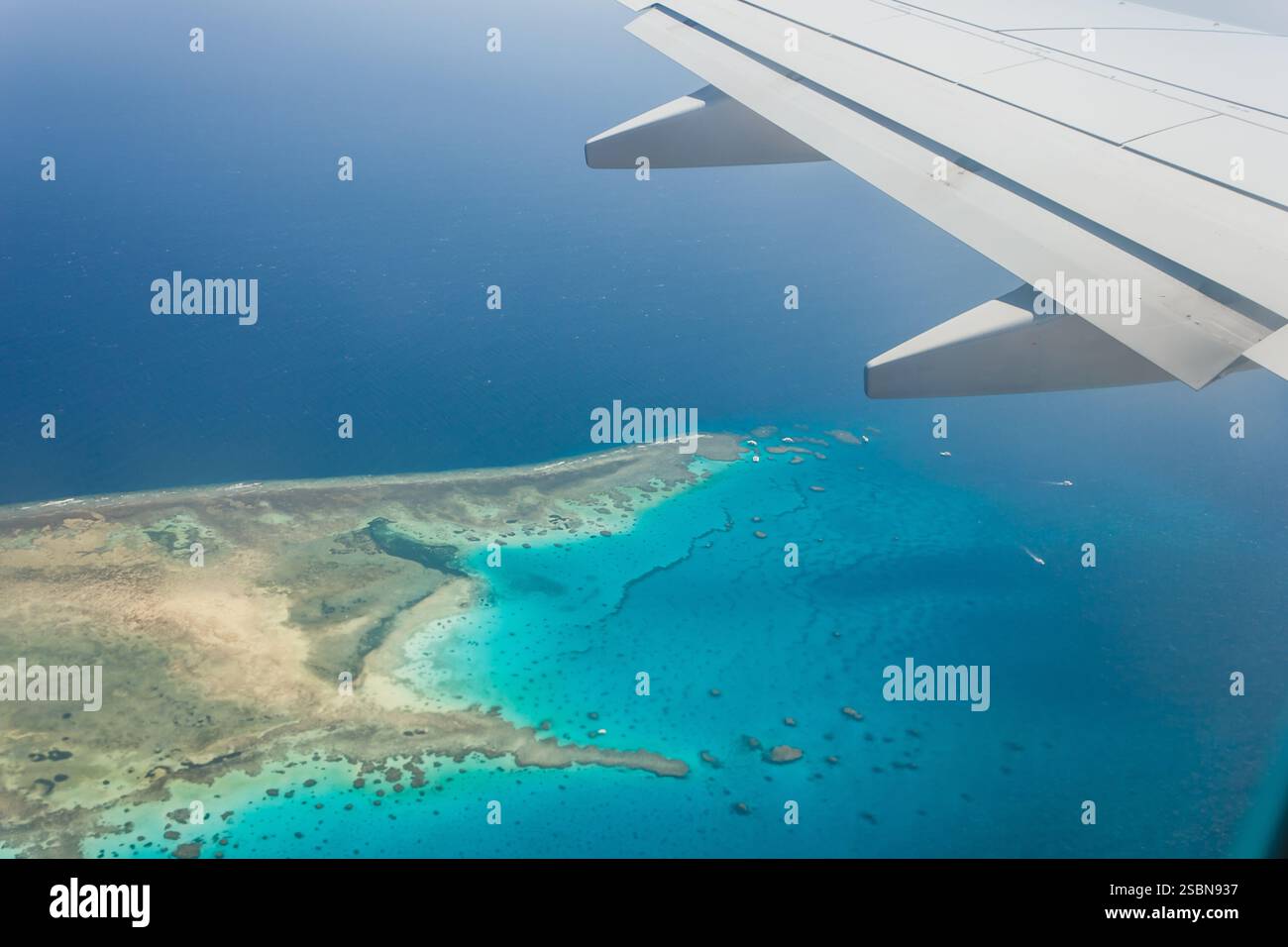 View from a plane window on the wing and the landscape below it Stock ...