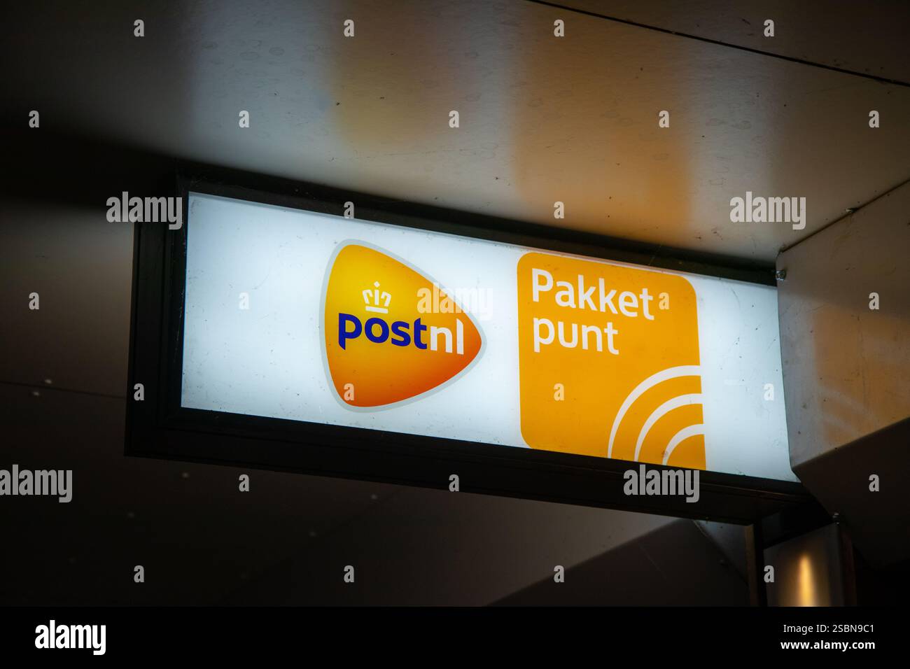 Postnl logo sign at pakket punt. The national and biggest postal ...