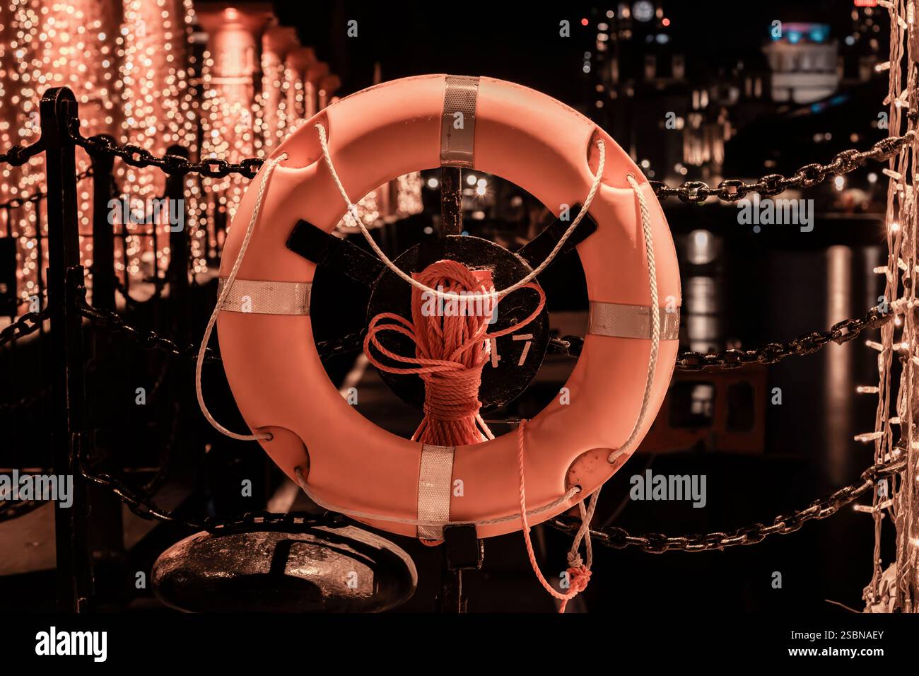 Lifebuoy at Liverpool docks at night with fairy lights. Life saving ...