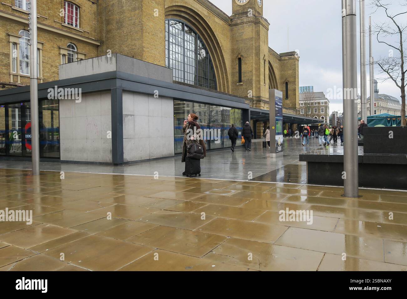 Woman vaping outside Kings Cross station Stock Photo - Alamy