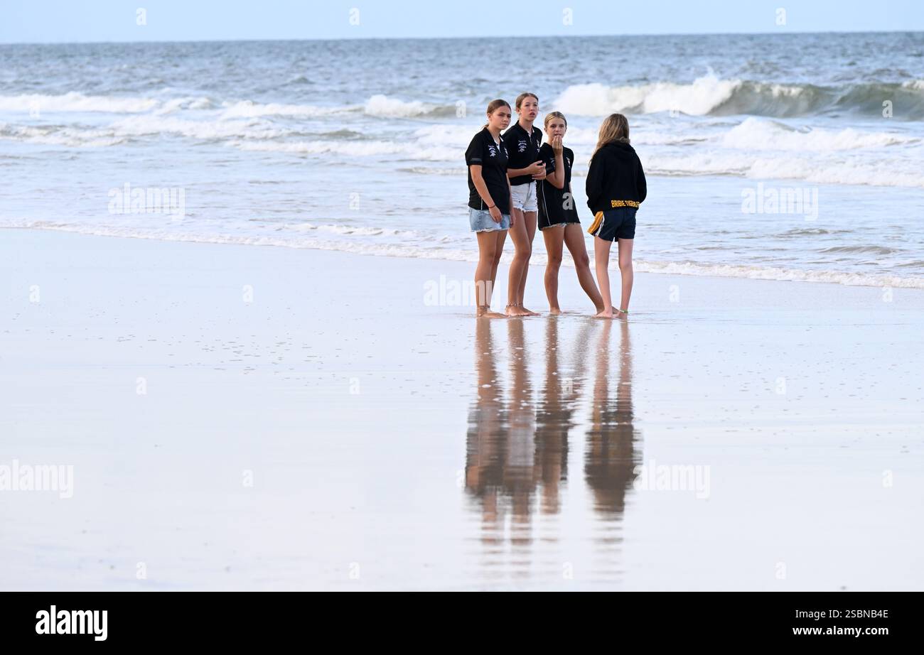 People are seen during a vigil for shark attack victim Charlize Zmuda ...