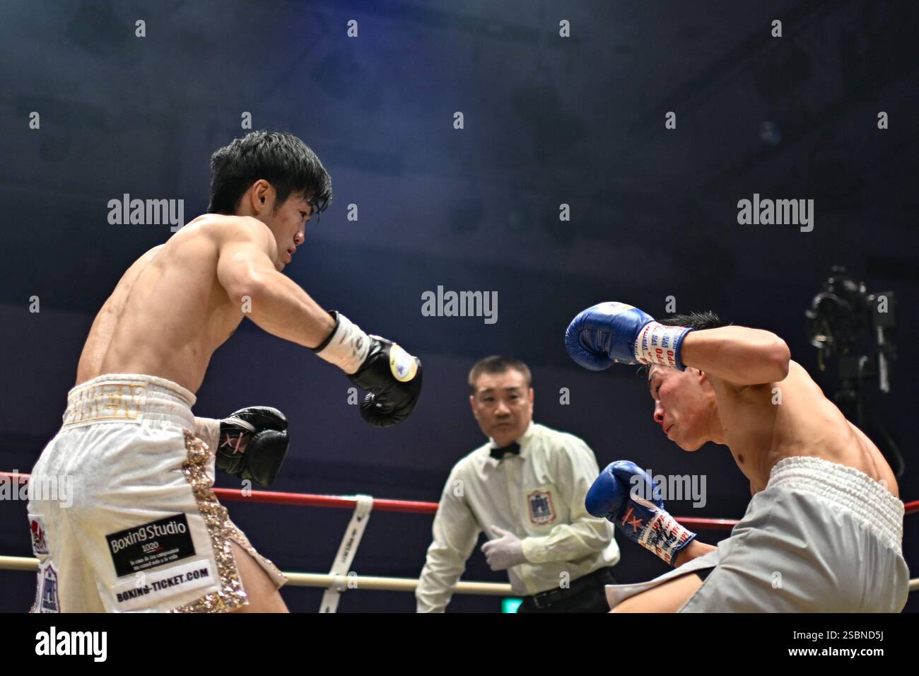 Tokyo, Japan. 18th Jan, 2025. Champion Mikito Nakano (black gloves) knocks down challenger ...