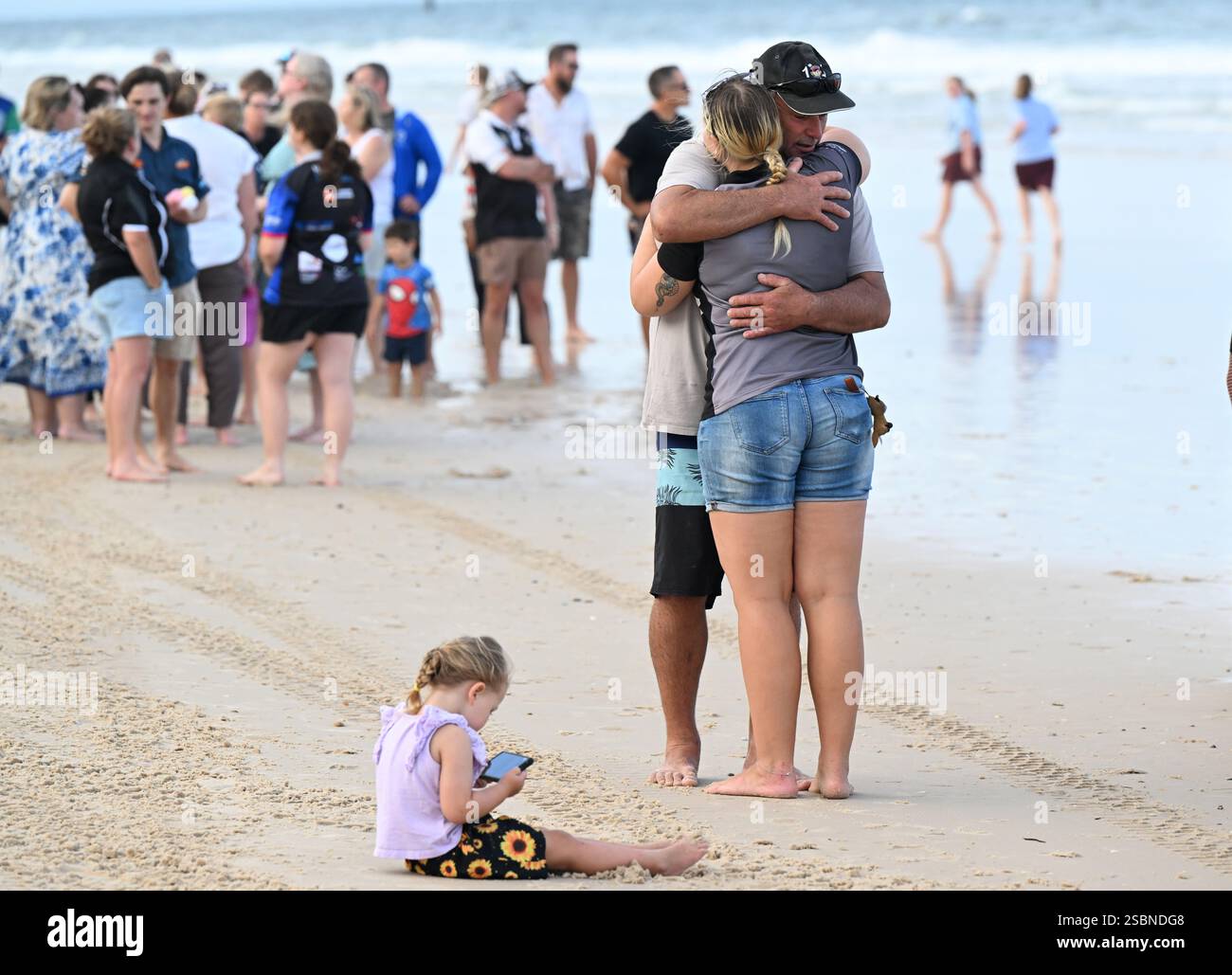 People are seen during a vigil for shark attack victim Charlize Zmuda ...