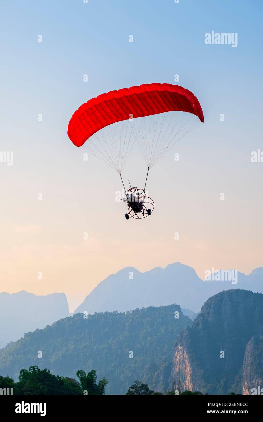 Laos, Vientiane province, Vang Vieng, paramotor flight above the karst ...