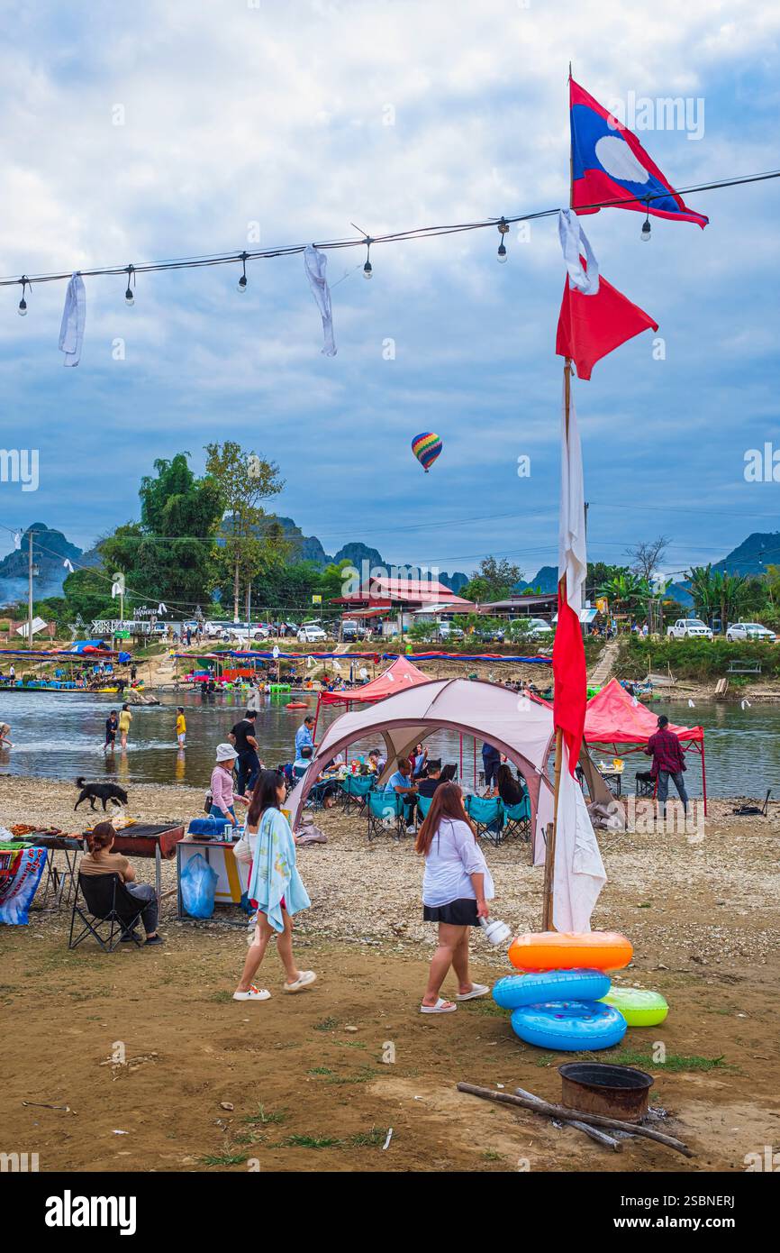 Laos, Vientiane province, Vang Vieng, bars and restaurants set up on ...